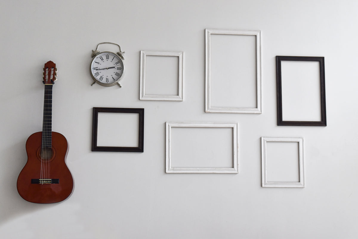 Elevate Your Home Decor with an Eclectic Wall Display of Masks, Clocks ...